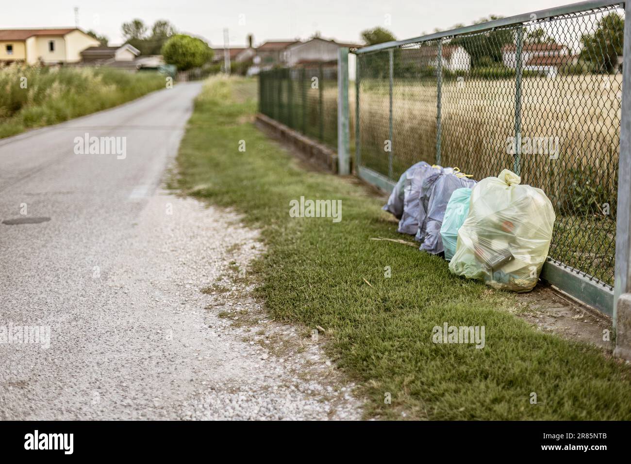 A striking image of abandoned trash bags, irresponsibly left by the ...