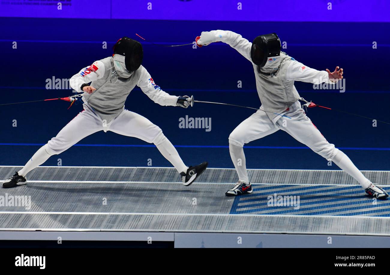 Wuxi. 19th June, 2023. Mo Ziwei (R) of China competes during the men's ...