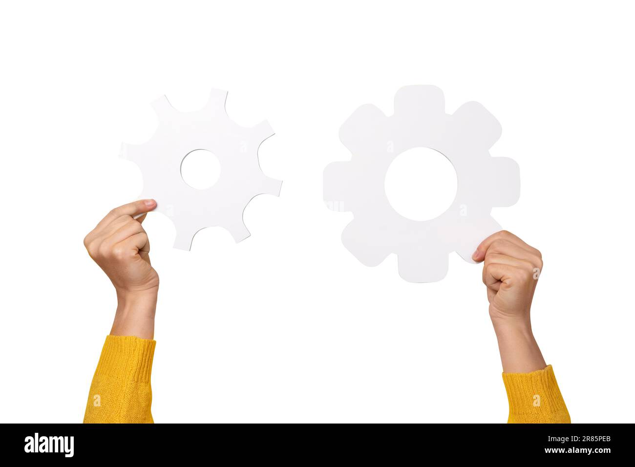 gear symbol in hands isolated on white background Stock Photo - Alamy