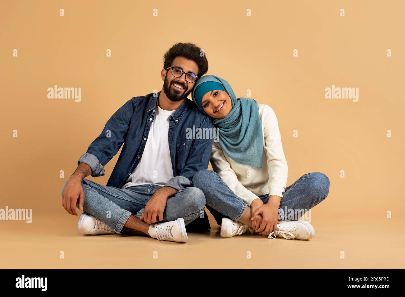 Happy Romantic Muslim Couple Posing Together Over Beige Studio ...