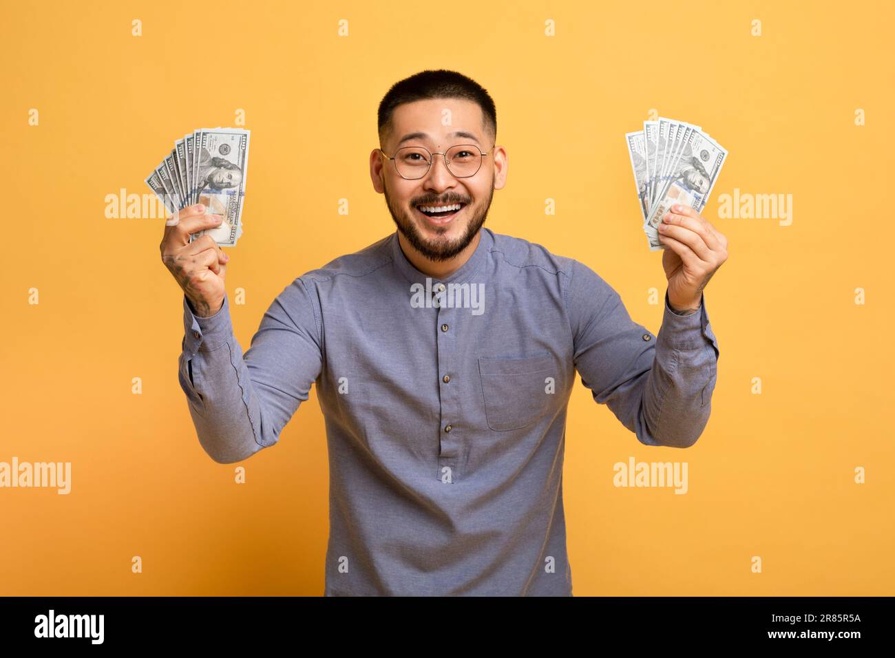 Lucky Winner. Excited Millennial Asian Man Holding Money Cash In Hands ...