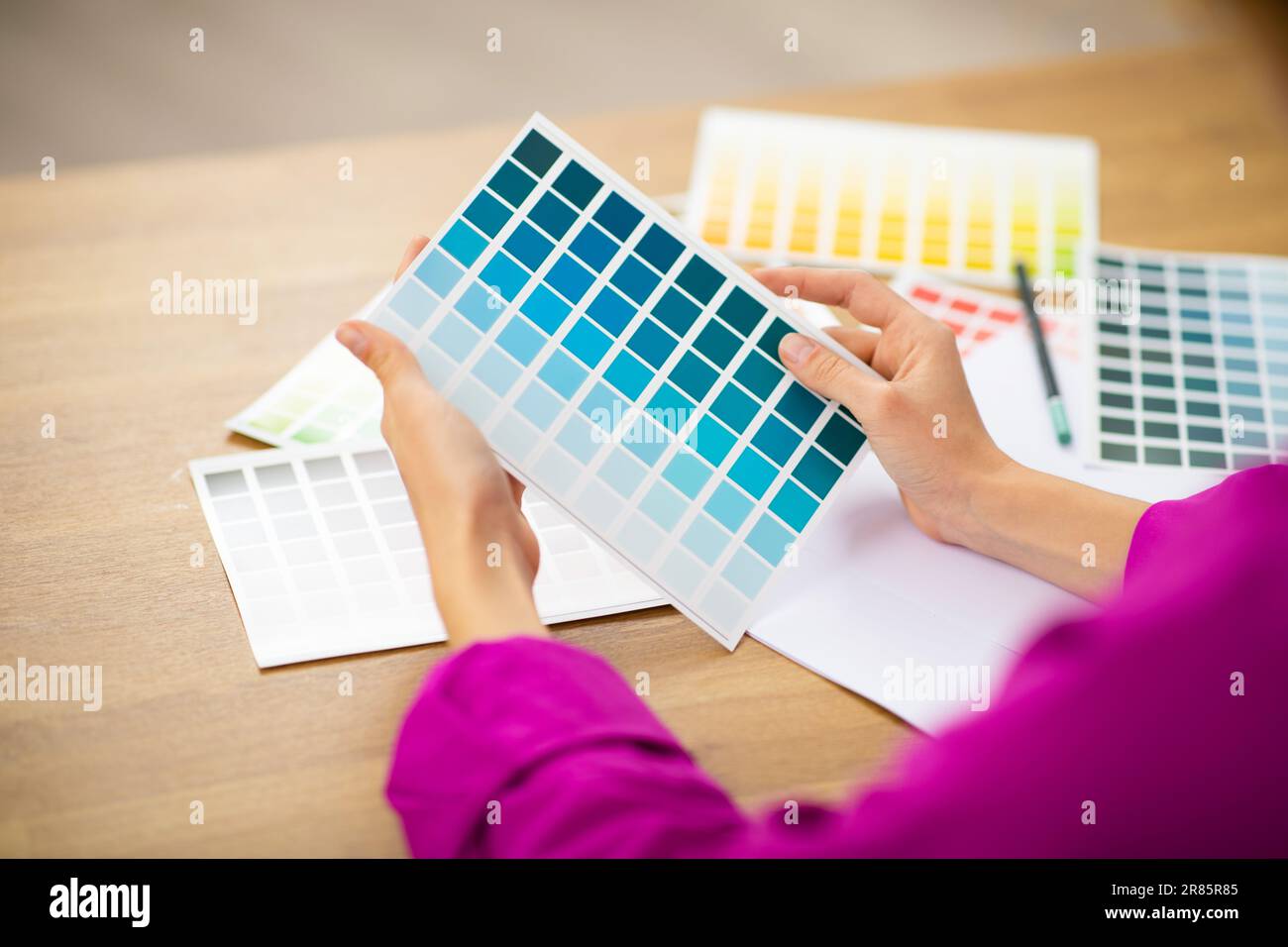 Cropped shot of interior designer woman working with color palette ...