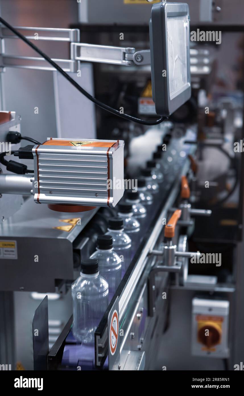 Liquid filling and bottle capping machine. Water bottling plant Stock ...