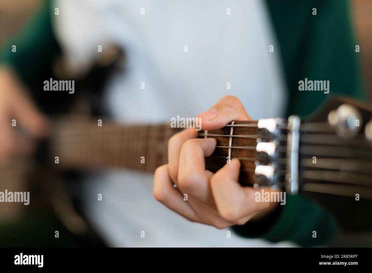 Closeup of Teen Boy's Hands Learning Chords on Guitar Indoors Stock ...