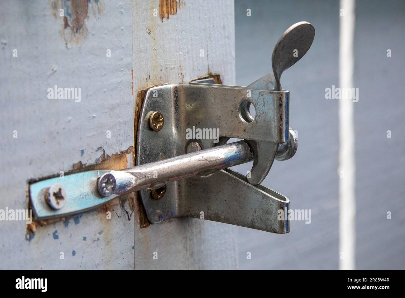 An old latch keeping gate locked Stock Photo - Alamy