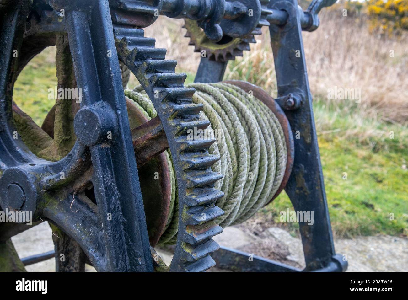 An old rope winch machine with large cogwheels Stock Photo - Alamy