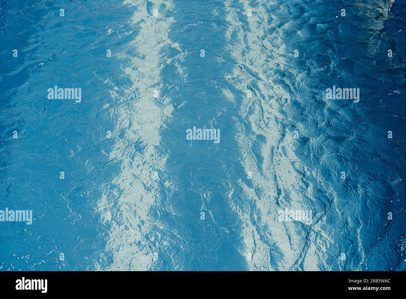 A view of the glistening textures and small ripples of a pool Stock ...
