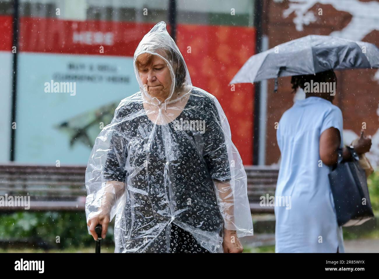 London Uk 12th June 2023 A Woman Wears A Rain Poncho During The Wet