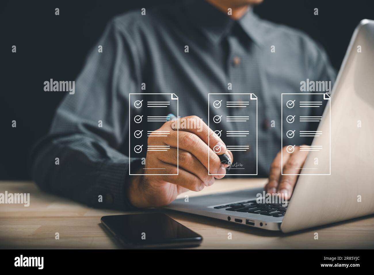 Efficient document management Businessman uses pen to sign electronic ...