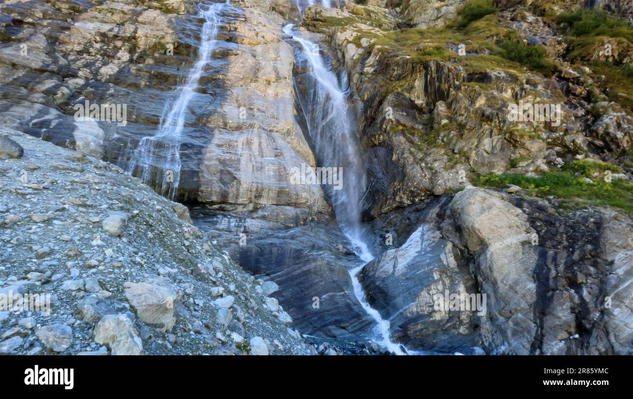 pretty mountain ridge highland fast water cascade at summertime day ...