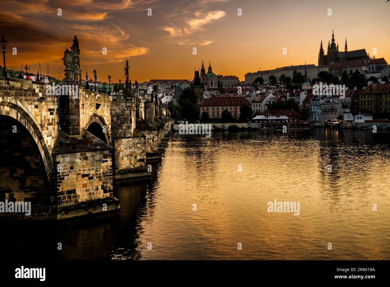 Prague, Bohemia - CZ– June 4, 2023 Sunset over the Charles Bridge, a ...