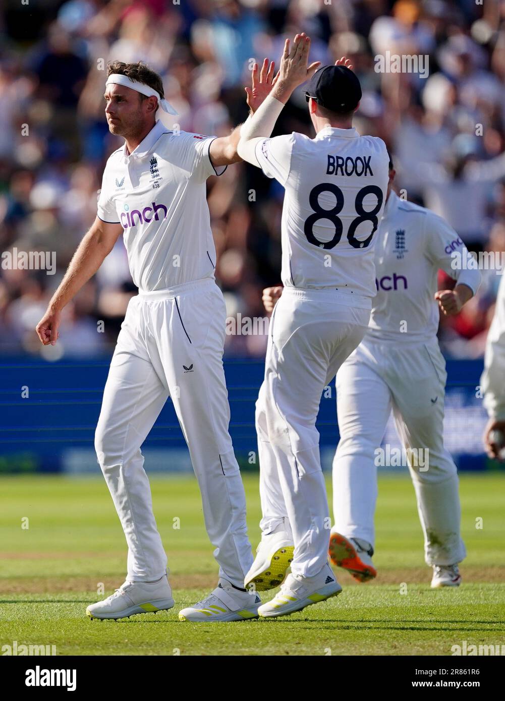 England’s Stuart Broad and Harry Brook celebrate the wicket of ...