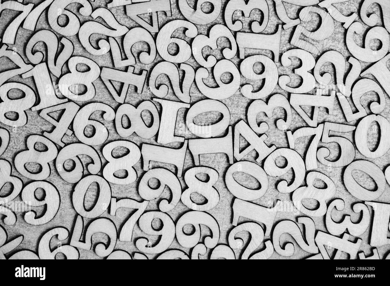 Abstract background with numbers cut out of plywood Stock Photo - Alamy