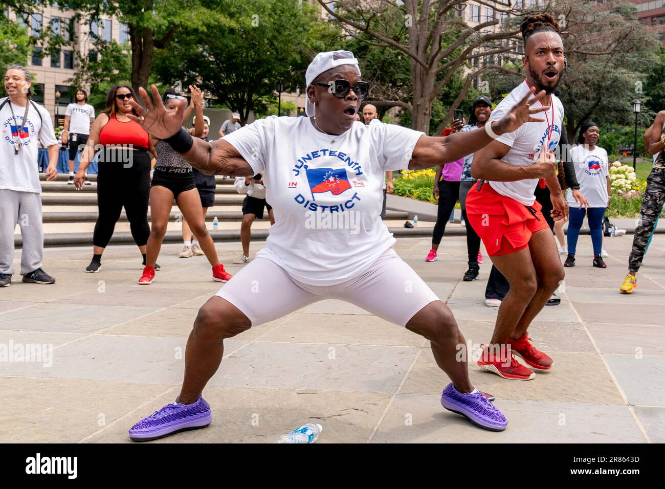 Jovan Jackson with PR Fitness Camp, right, reacts as he puts Marcia Lee ...