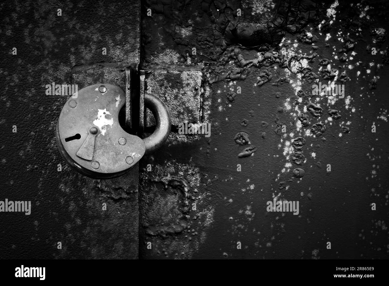 Old rusty lock on metal doors. Lock on the door with an empty place for ...