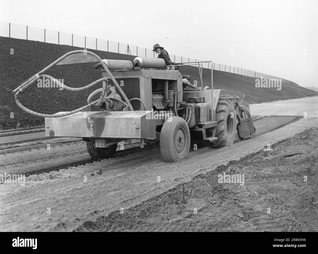 Construction of the M11 MotorwayRoad worker Stock Photo - Alamy