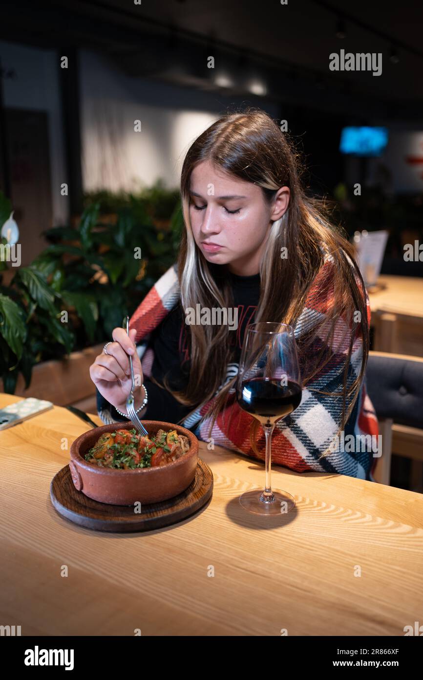 Unhappy eating in restaurant hi-res stock photography and images - Alamy