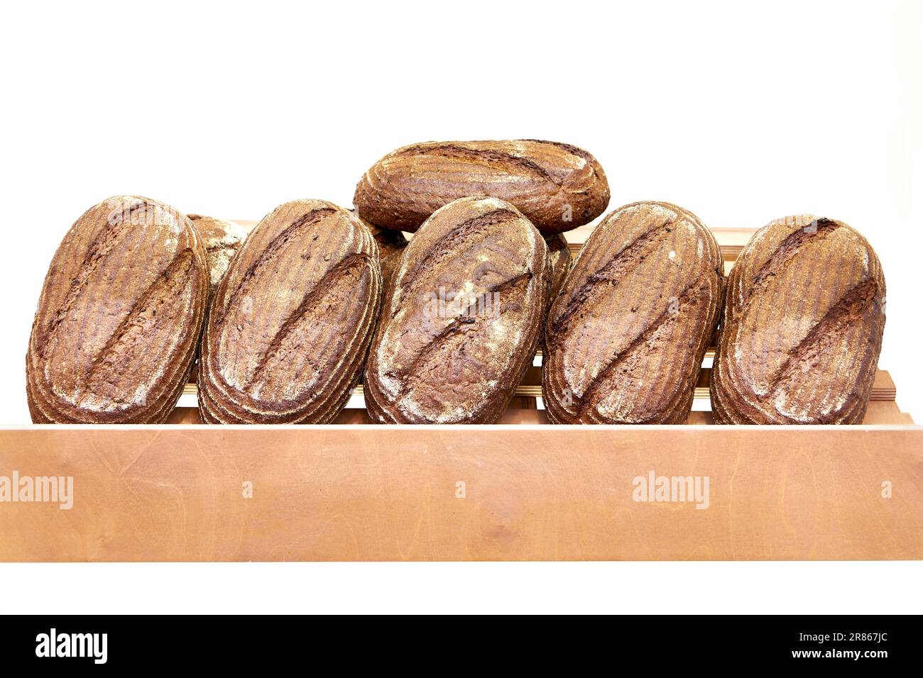 Fresh bread on shelves in a bakery isolate white background Stock Photo ...
