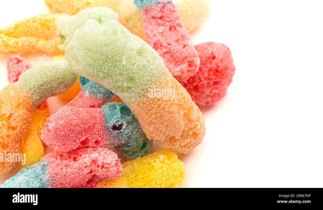 Freeze Dried Bicolored Candy Sour Worms Isolated on a White Background ...