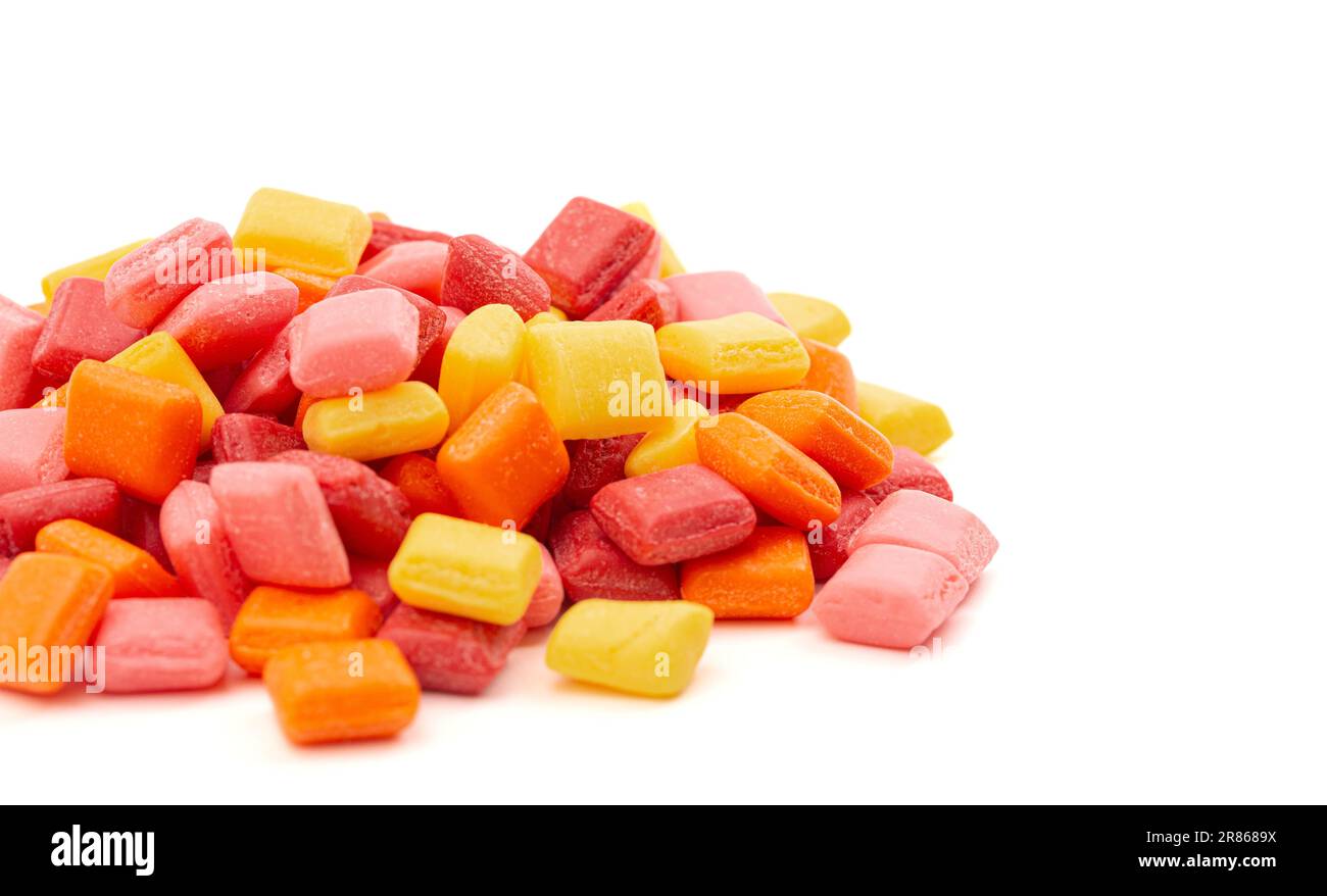 Pile of Rainbow Colored Small Chewy Square Candies Isolated on a White ...