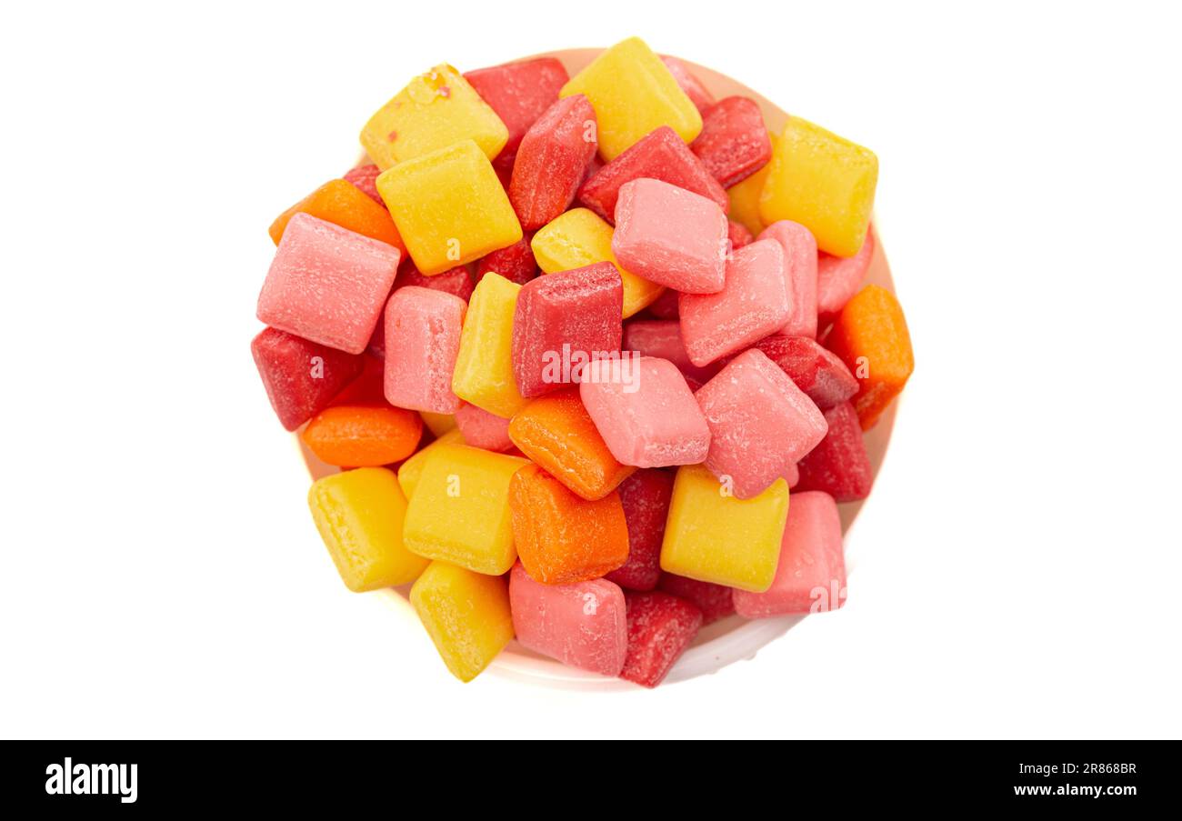 Pile of Rainbow Colored Small Chewy Square Candies Isolated on a White ...