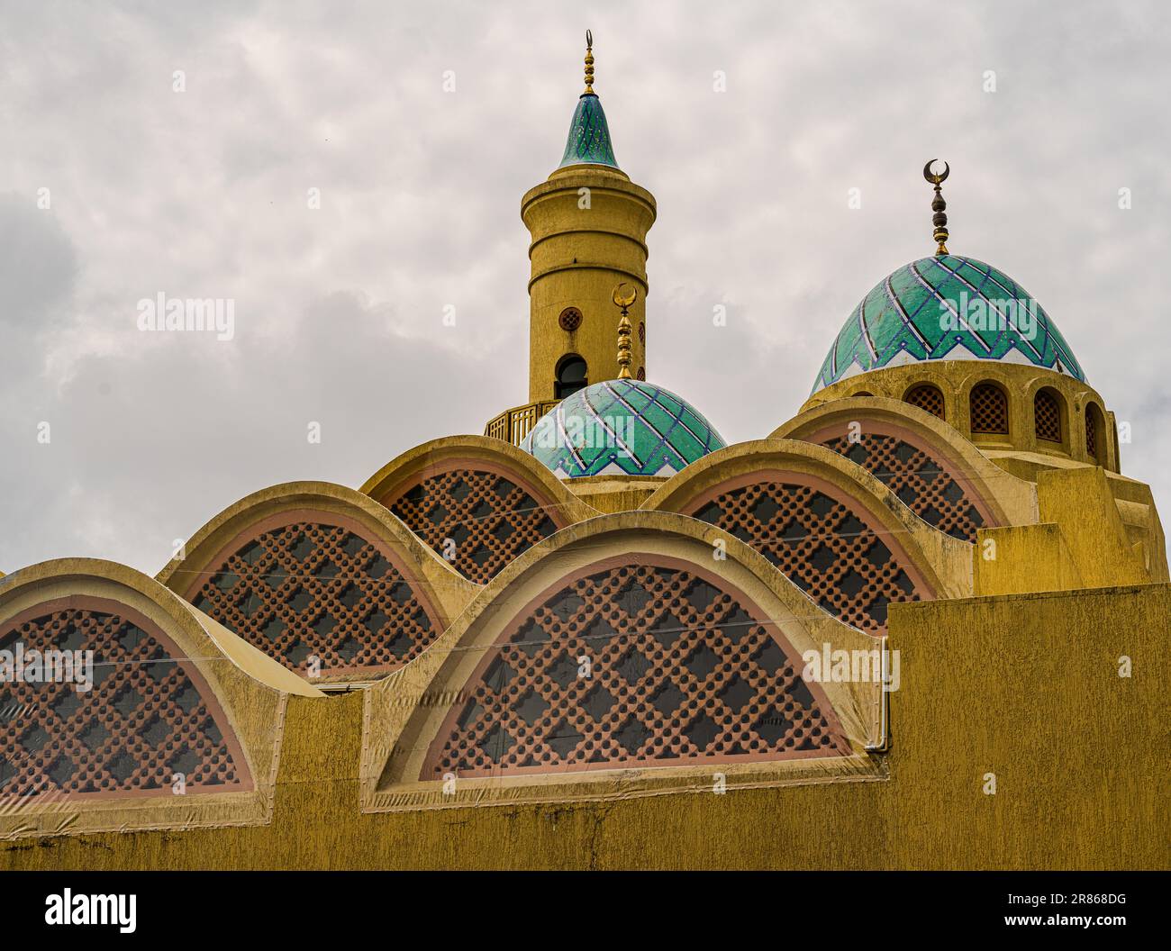 A shot of 2 domes and a minaret on top of the Ash-Shaliheen Mosque ...
