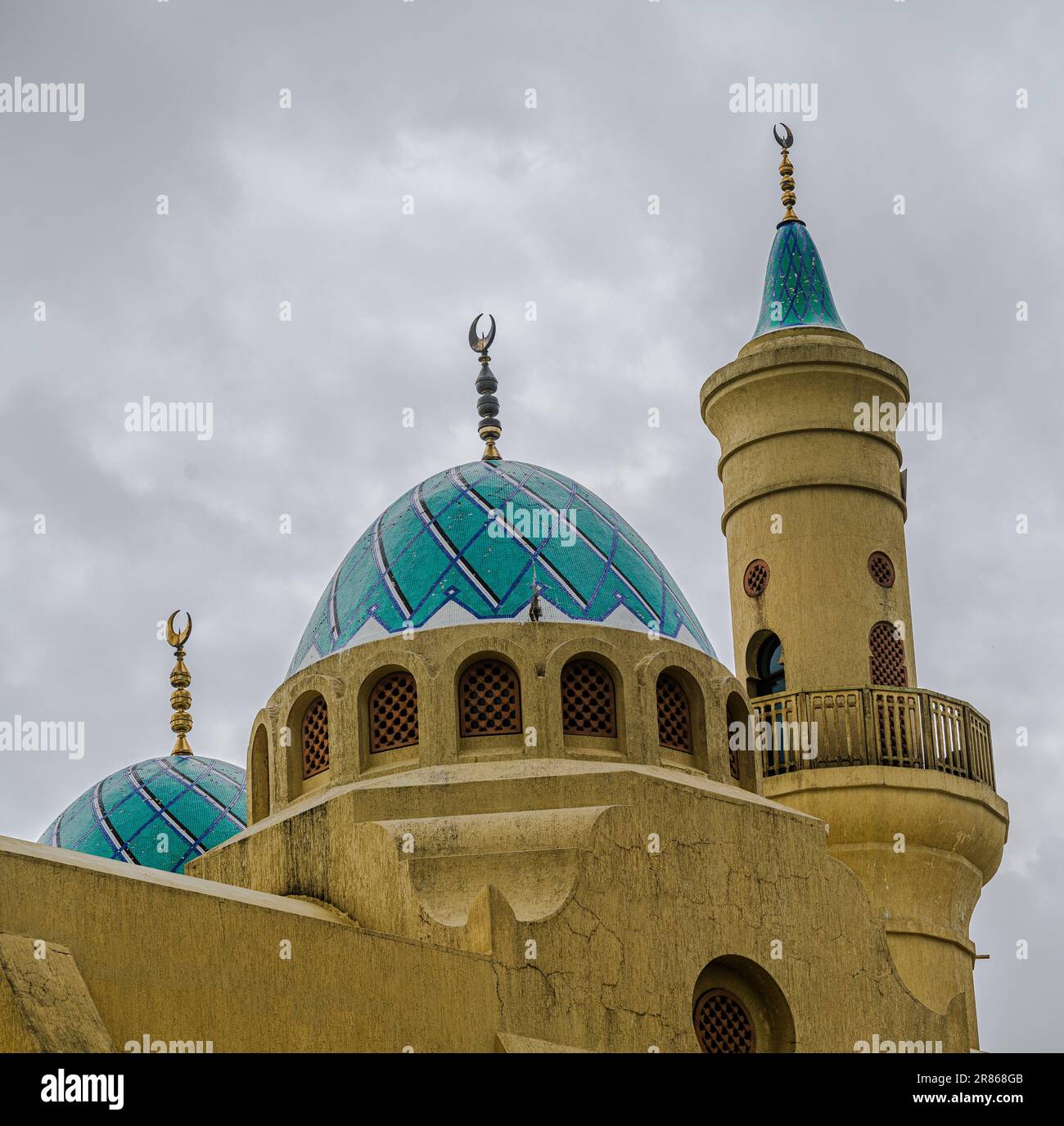 An image that captures domes and a minaret of the Ash-Shaliheen Mosque ...