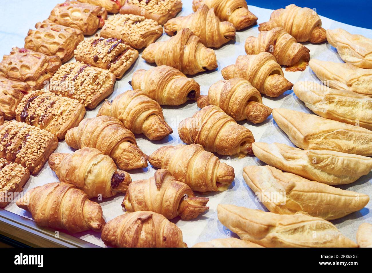 Fresh croissants and buns french bakery food Stock Photo - Alamy
