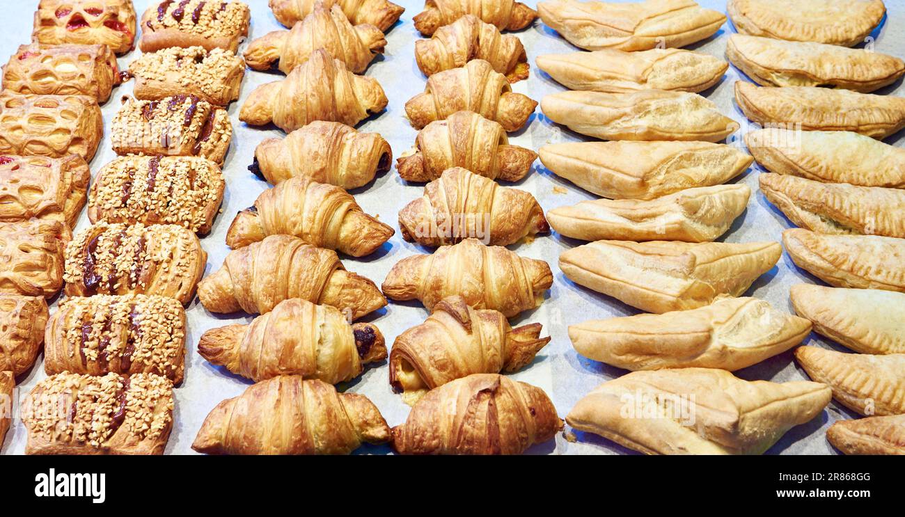 Fresh croissants and buns french bakery food Stock Photo - Alamy