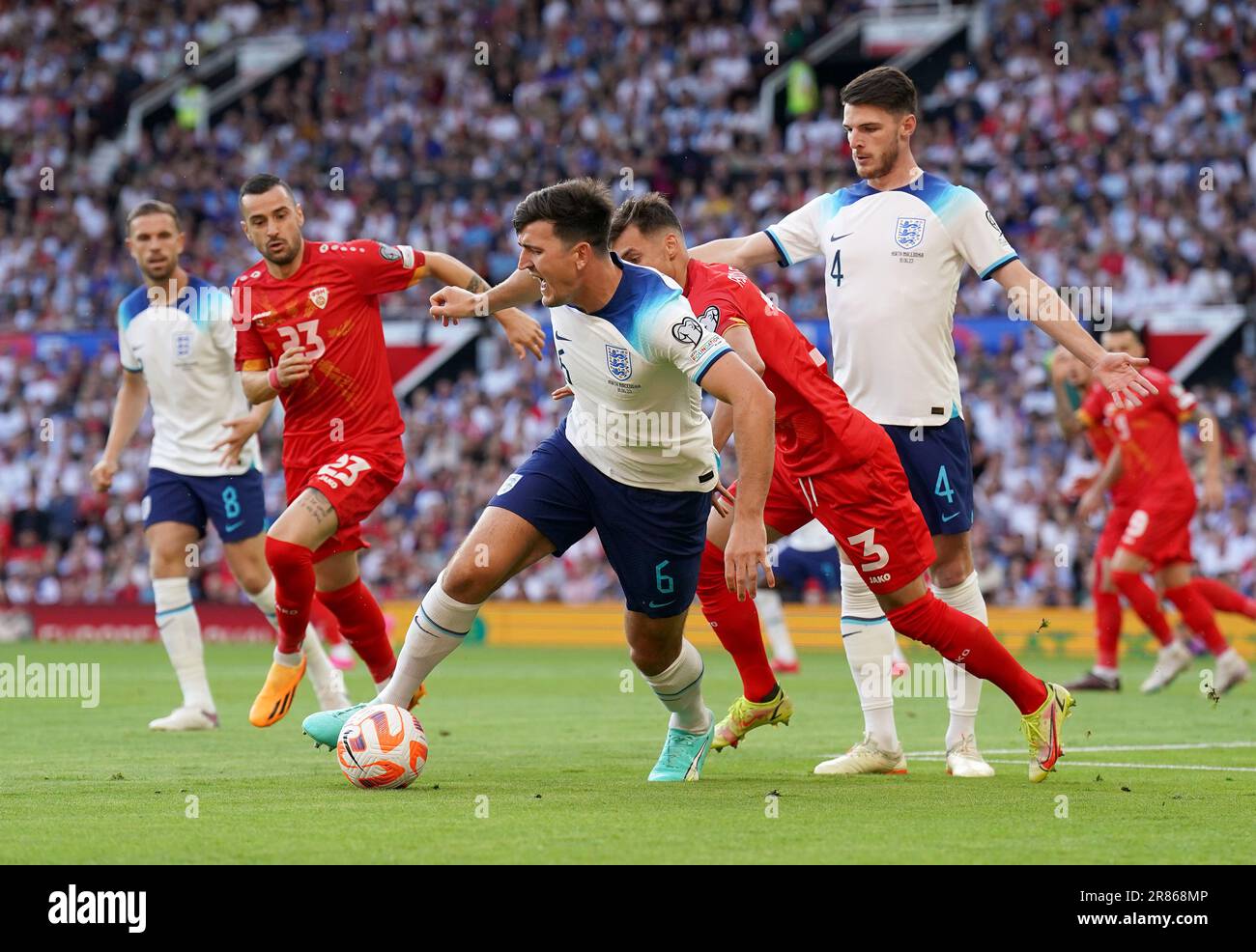 England's Harry Maguire (centre) and North Macedonia's Stefan Askovski ...