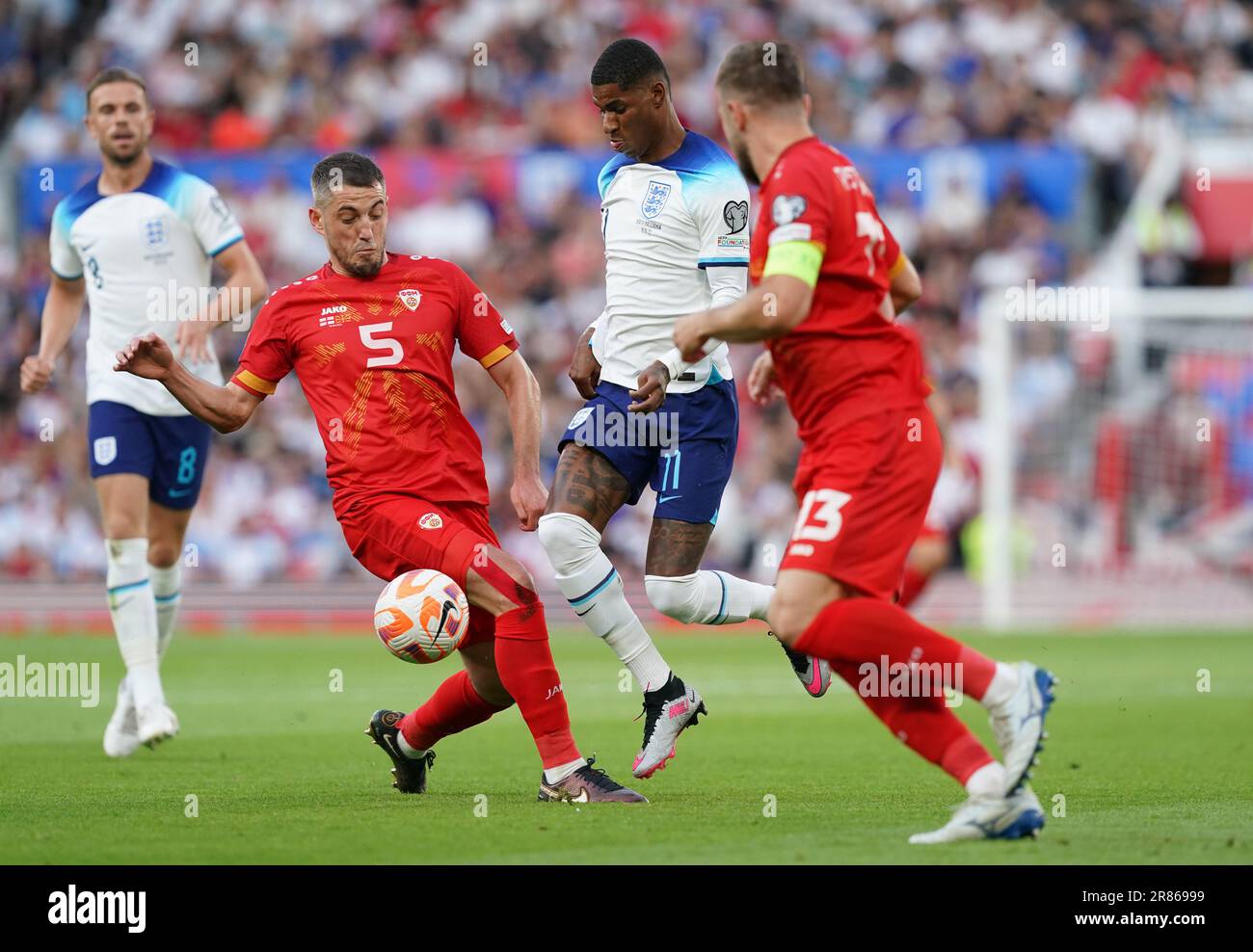 England's Marcus Rashford (centre) and North Macedonia's Arijan Ademi ...