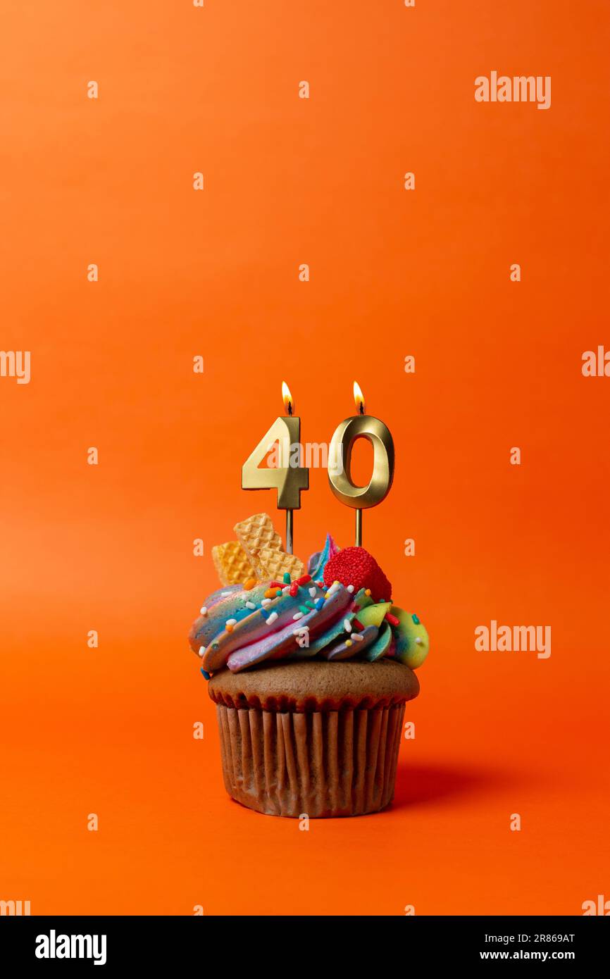 birthday cake with number 40 - cupcake on orange background with ...