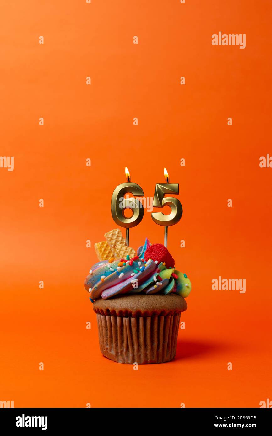 birthday cake with number 65 - cupcake on orange background with ...