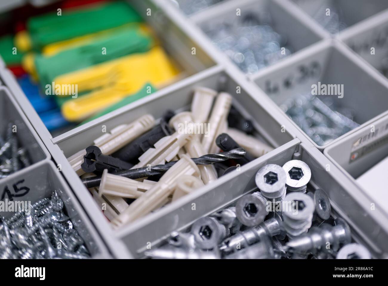Berlin, Germany. 19th June, 2023. Screws and dowels are sorted in a ...