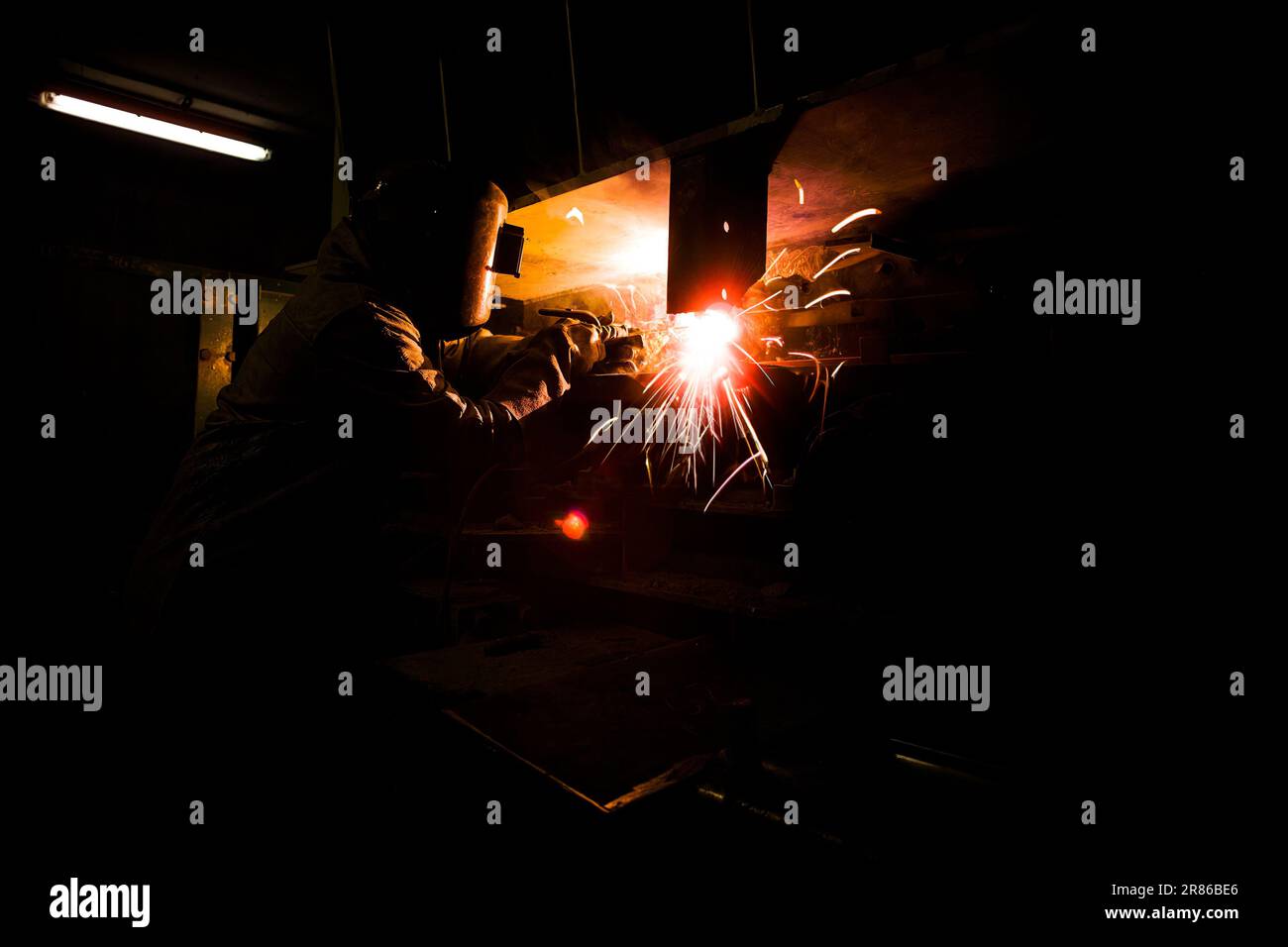 Welder at work in a copper mine Stock Photo - Alamy