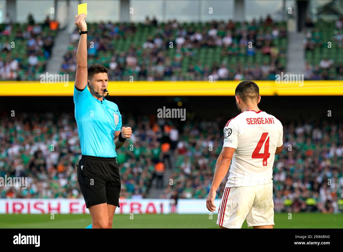 Gibraltar's Jack Sergeant (right) is shown a yellow card after a tackle ...