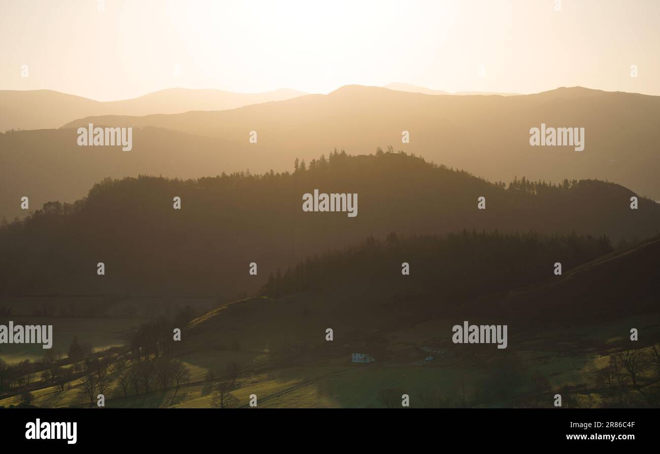 Sunrise over a ridge in the Derwent Fells from below the summit of ...