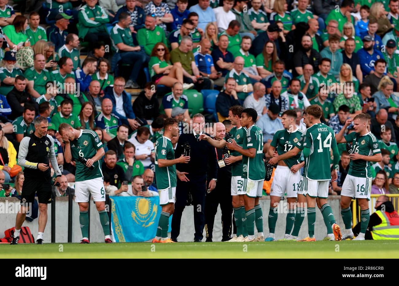 Northern Ireland manager Michael O'Neill speaks with his players during ...