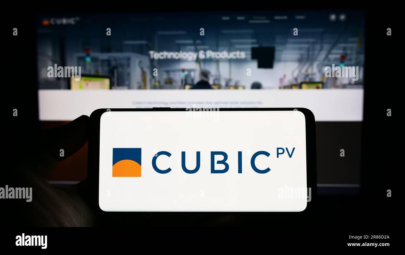 Person holding mobile phone with logo of American company CubicPV ...