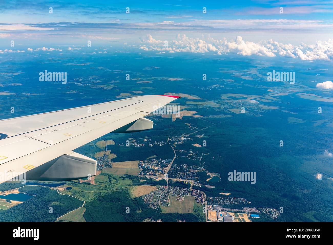 View from the airplane window at a beautiful cloudy sky and the ...