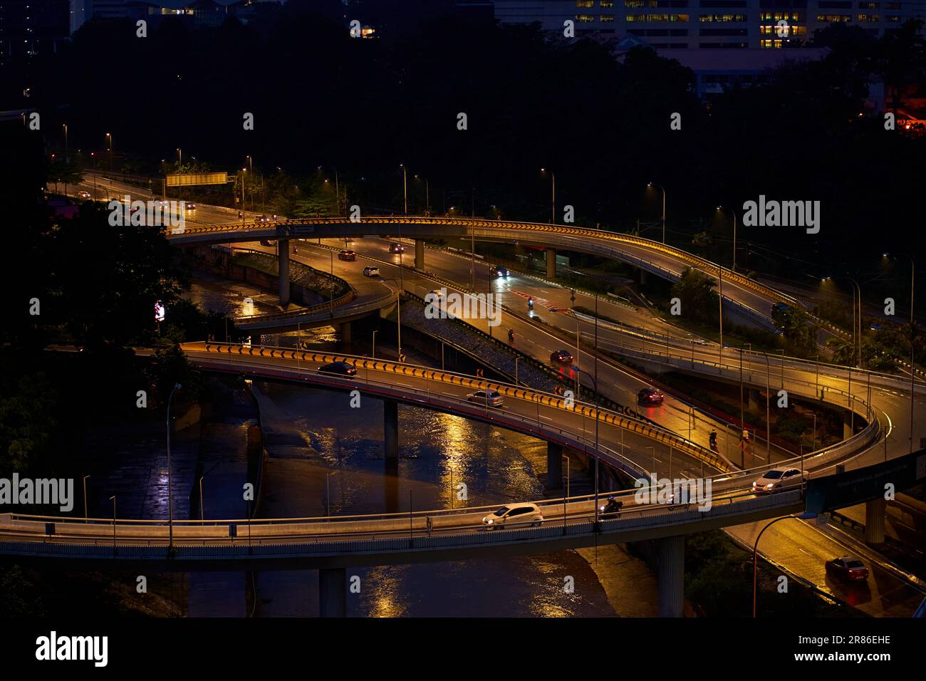 Multi level road junction with heavy car traffic hi-res stock ...