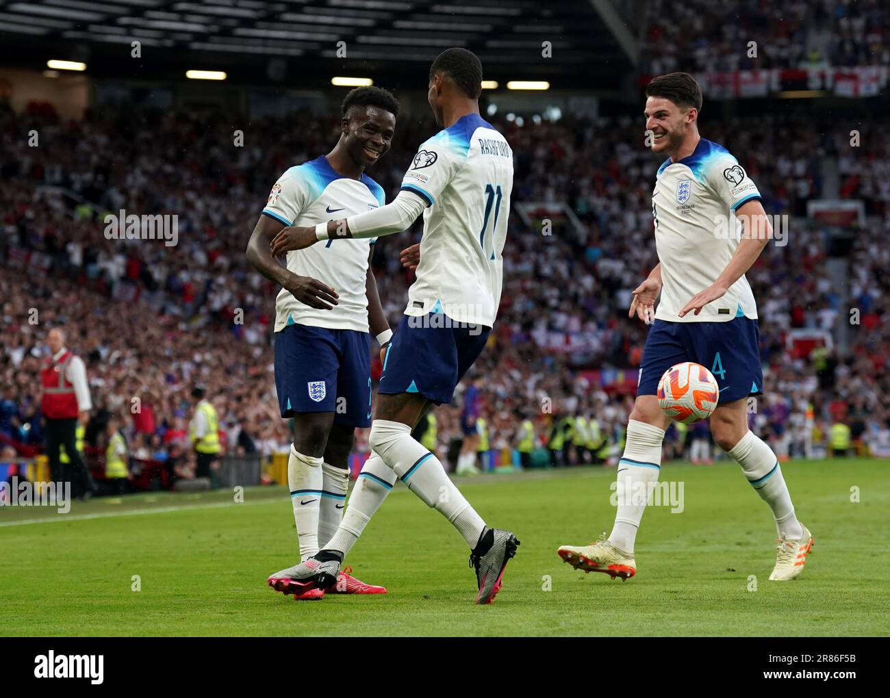 England's Bukayo Saka (left) celebrates with Marcus Rashford (centre ...