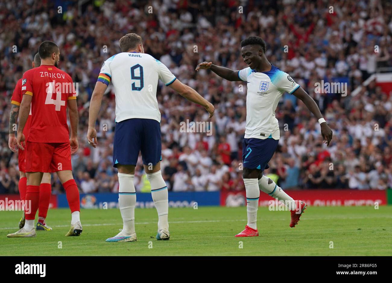 England's Bukayo Saka (right) celebrates with Harry Kane after scoring ...