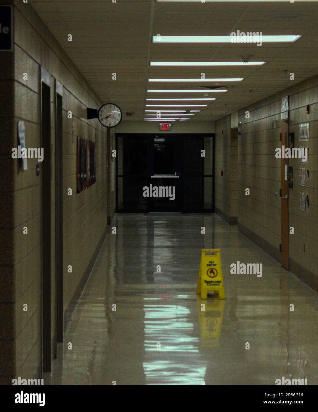 Empty school hallway with wet floor sign Stock Photo - Alamy