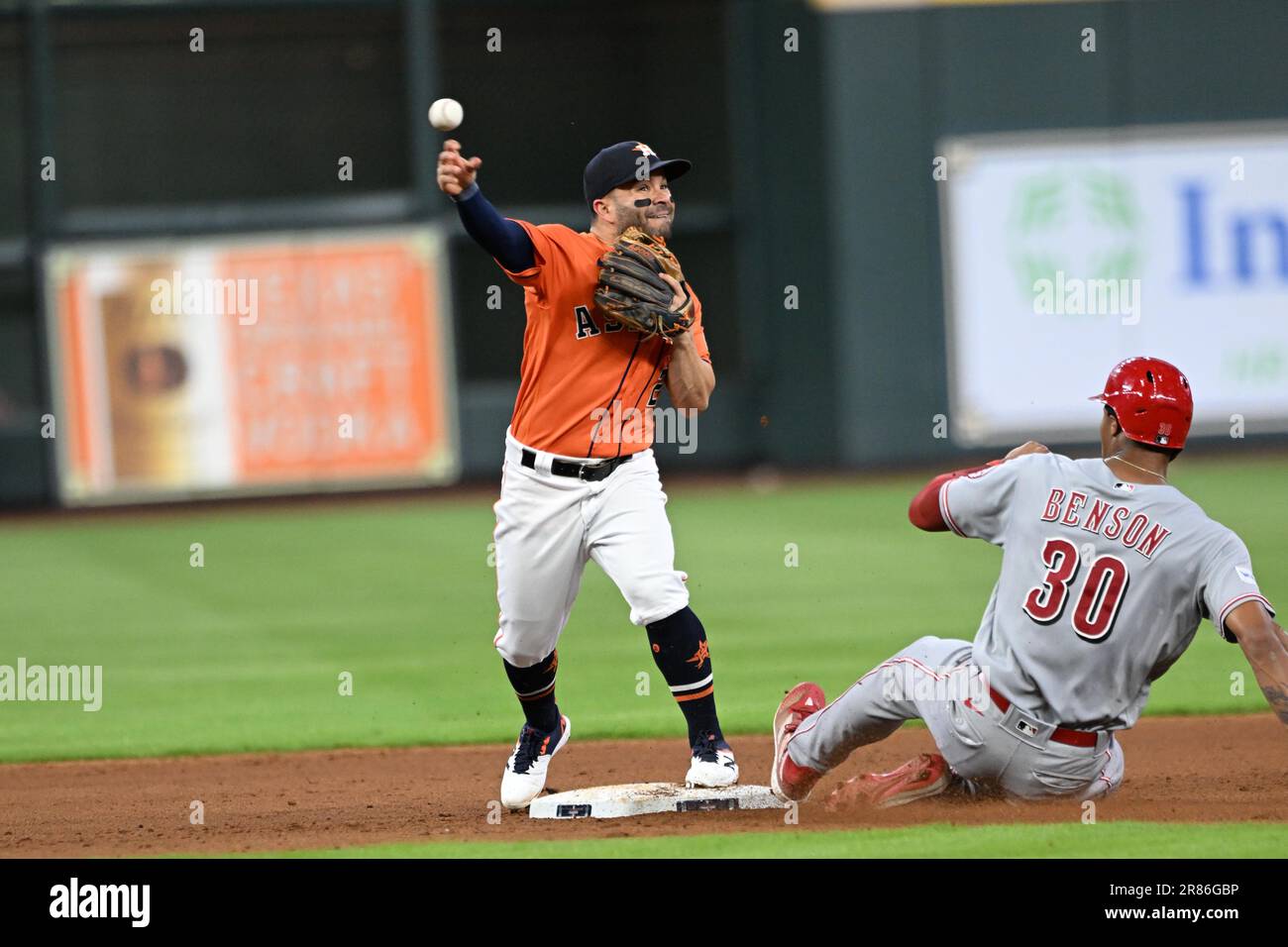 Houston Astros second baseman Jose Altuve (27) turns a double play ...