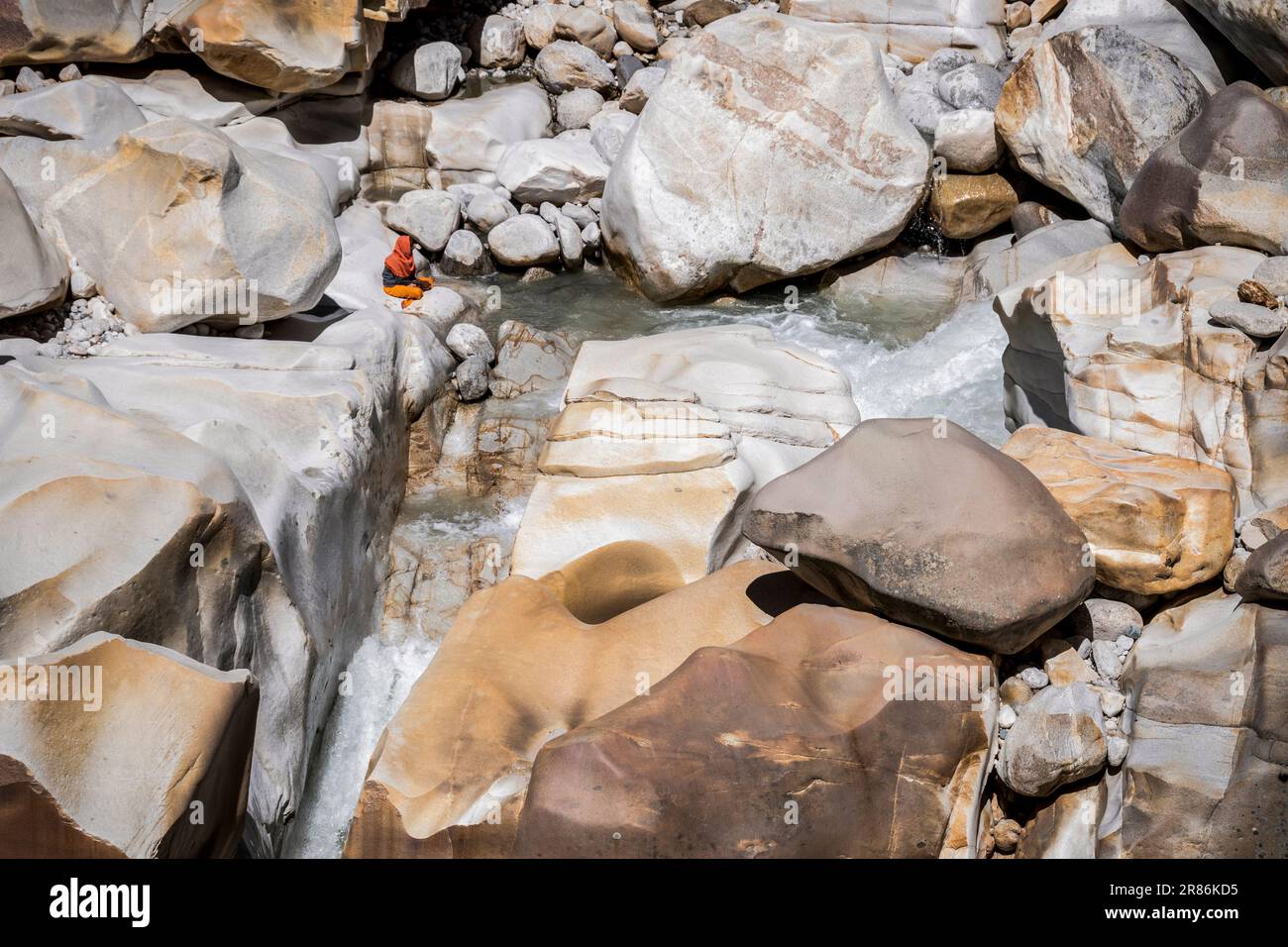 A holy man meditates on the banks of the source of the Ganges River ...