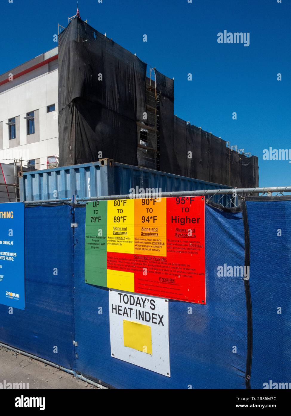 A color coded sign at a construction site in Costa Mesa, CA, lists ...