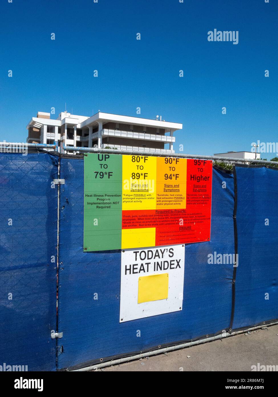 A color coded sign at a construction site in Costa Mesa, CA, lists ...