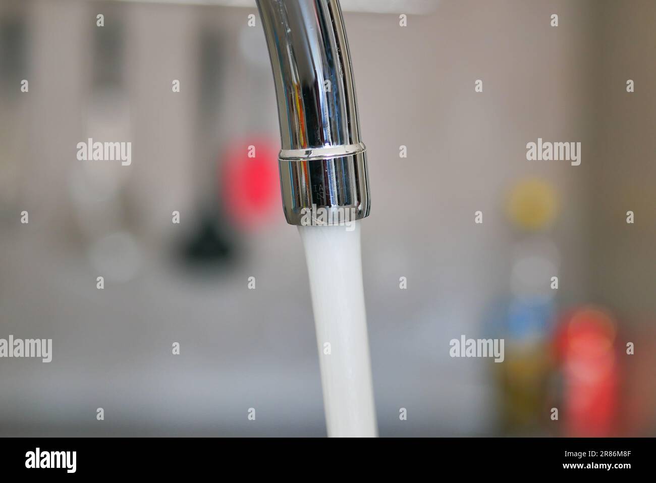 water pouring from a faucet tap slow motion Stock Photo - Alamy