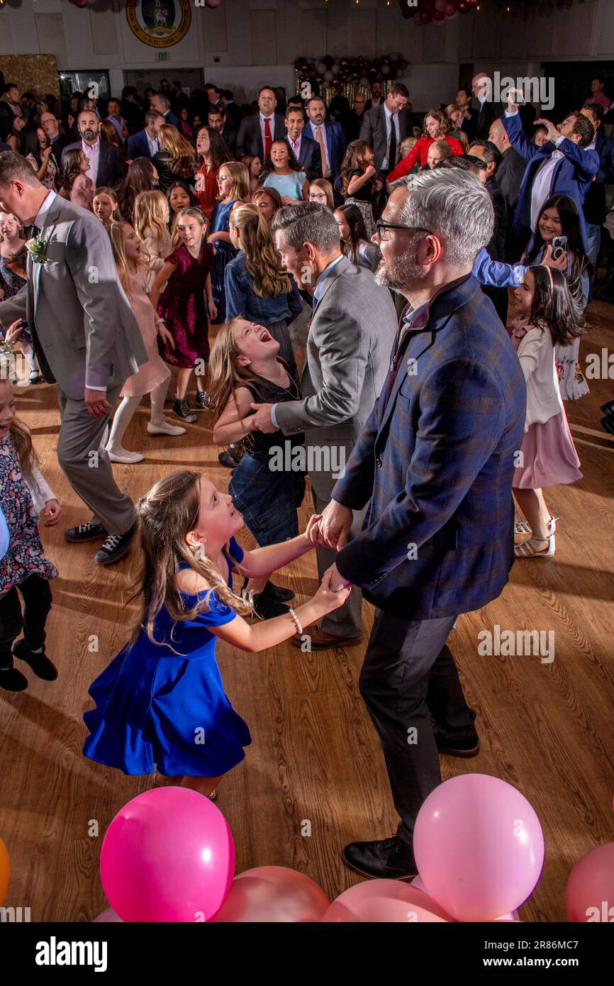 Fathers and daughters dance at a Southern California Catholic middle ...